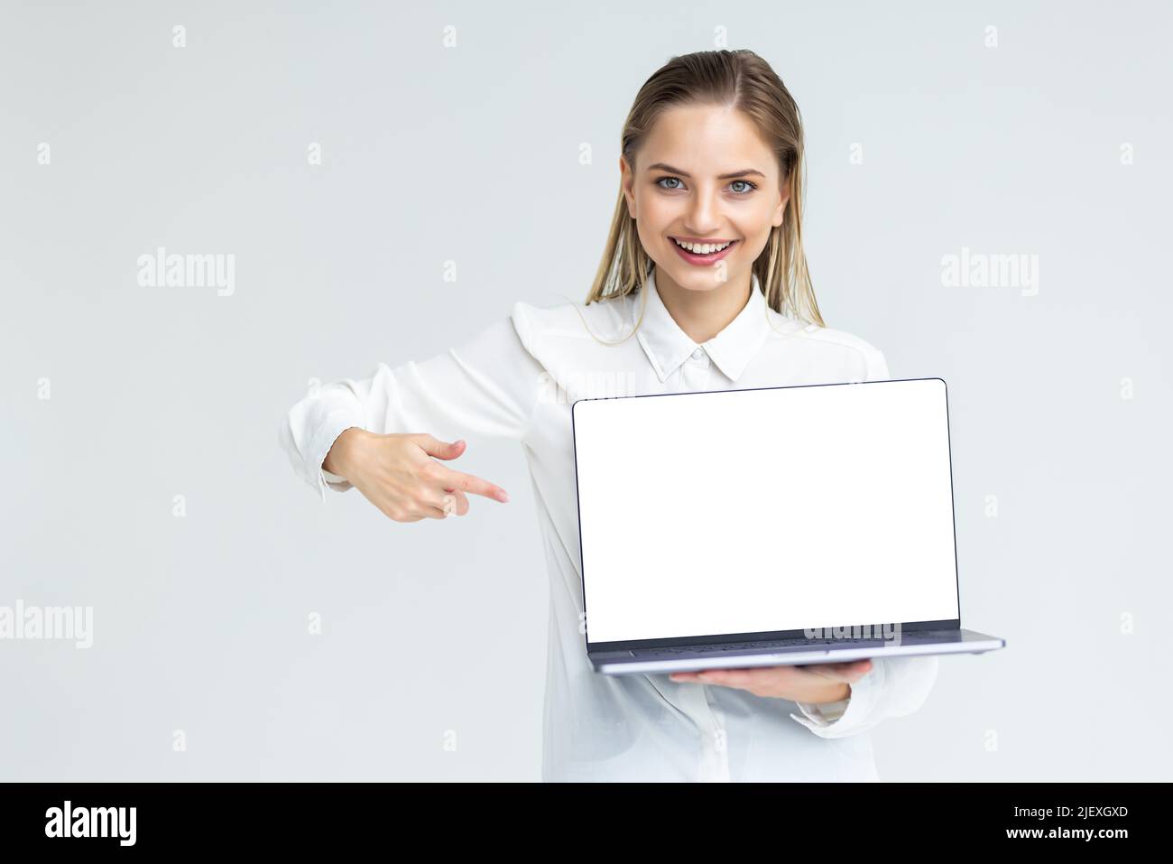 beautiful business woman smile sitting at the desk looking at camera ...