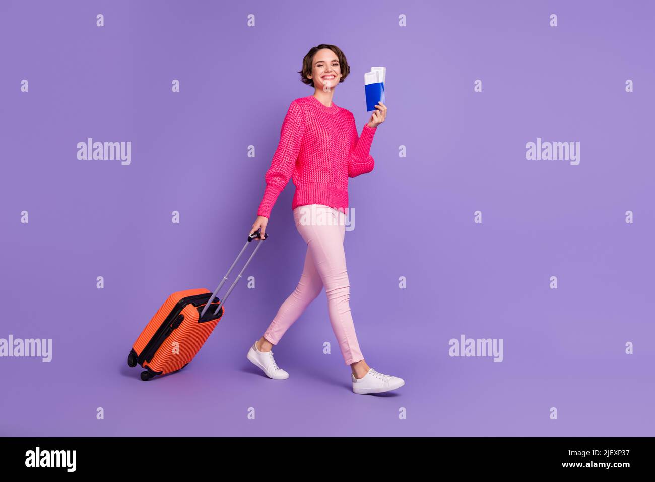 Full length profile photo of excited charming person walking hold ...