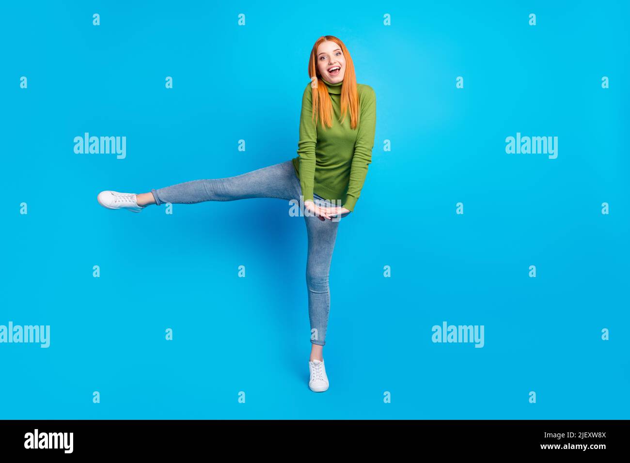 Full body photo of satisfied young lady toothy smile raise leg look ...