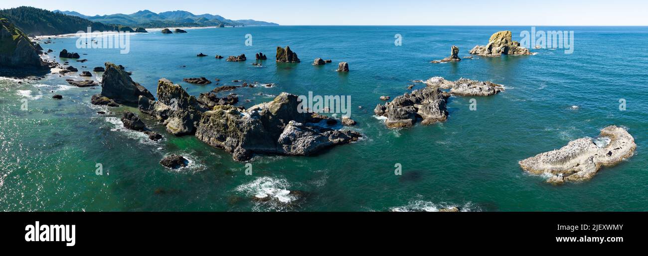 Basalt sea stacks lie just off the Northern Oregon shoreline, not far ...