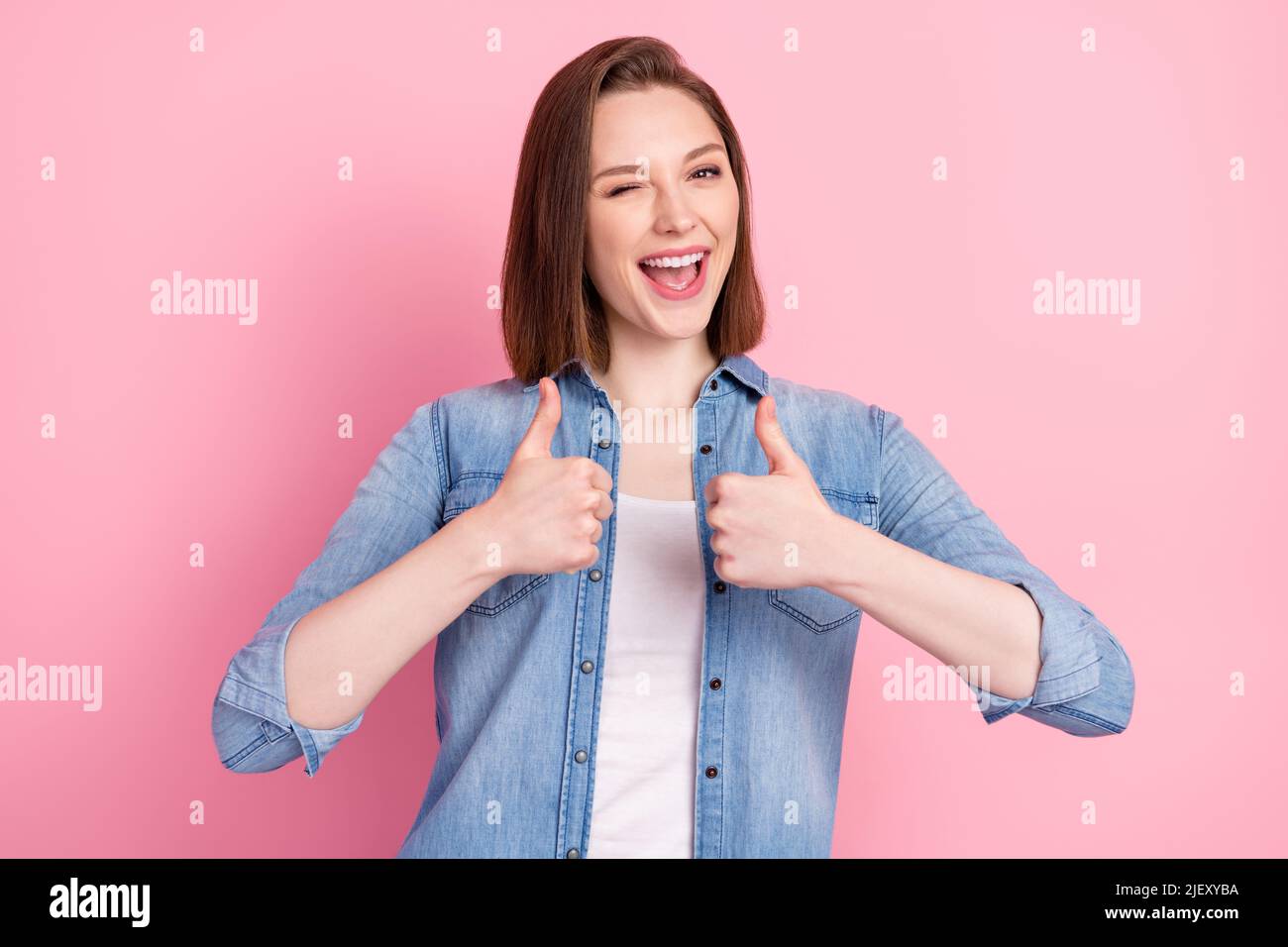 Photo portrait of girl smiling showing thumb-up like gesture winking ...