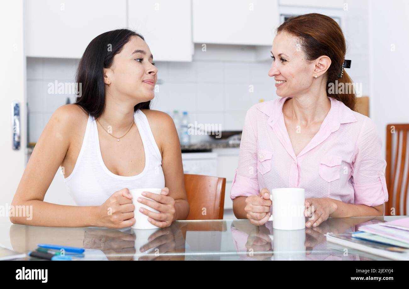Two women having conversation Stock Photo - Alamy