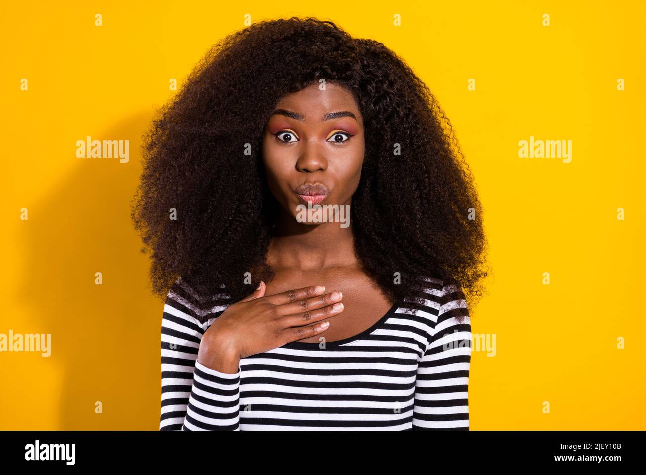 Photo Portrait Of Young Model Amazed Sending Air Kiss Hand On Chest Isolated Bright Yellow Color