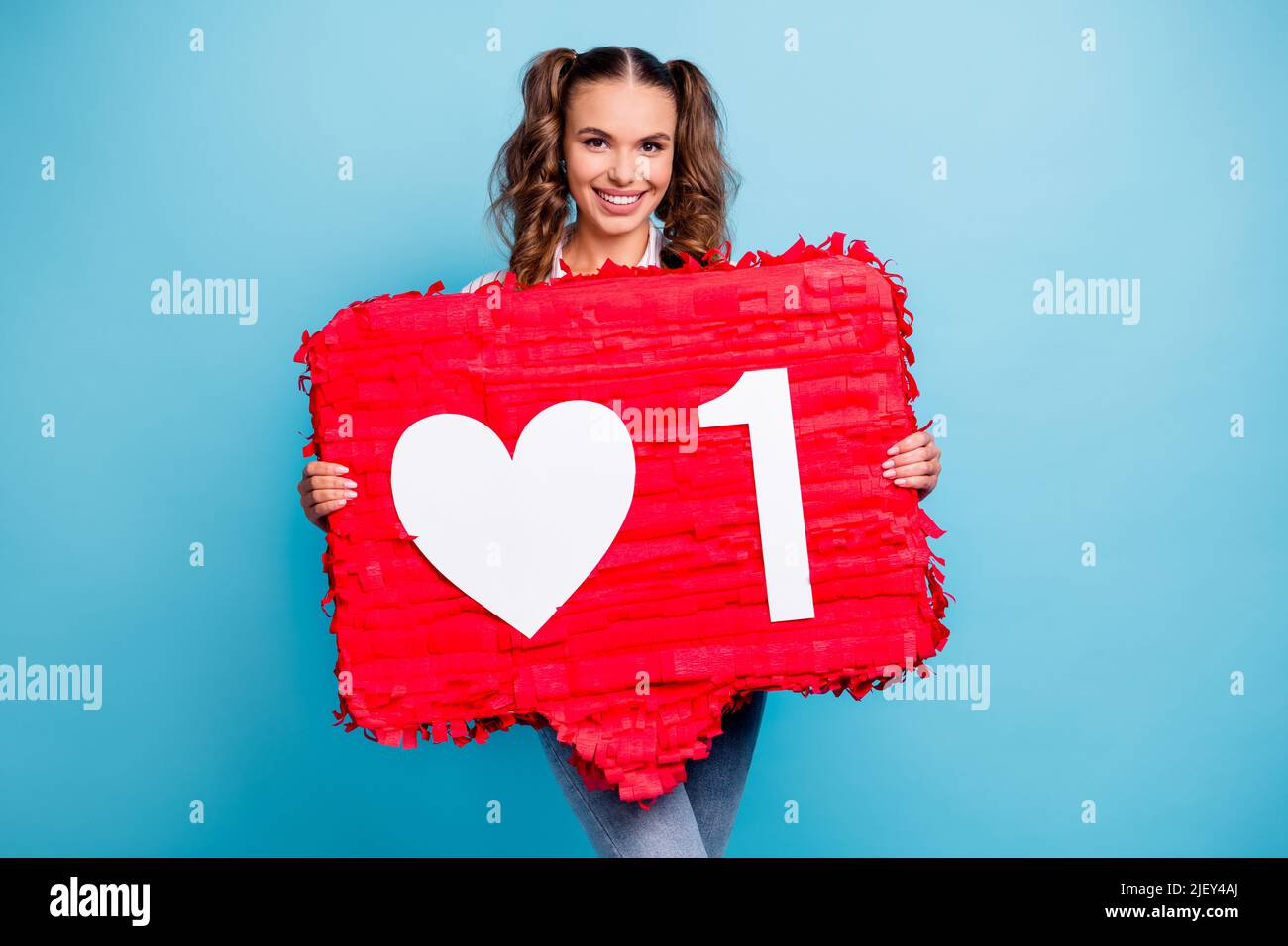 Portrait of lovely cheerful brown-haired girl holding in hands big sign ...