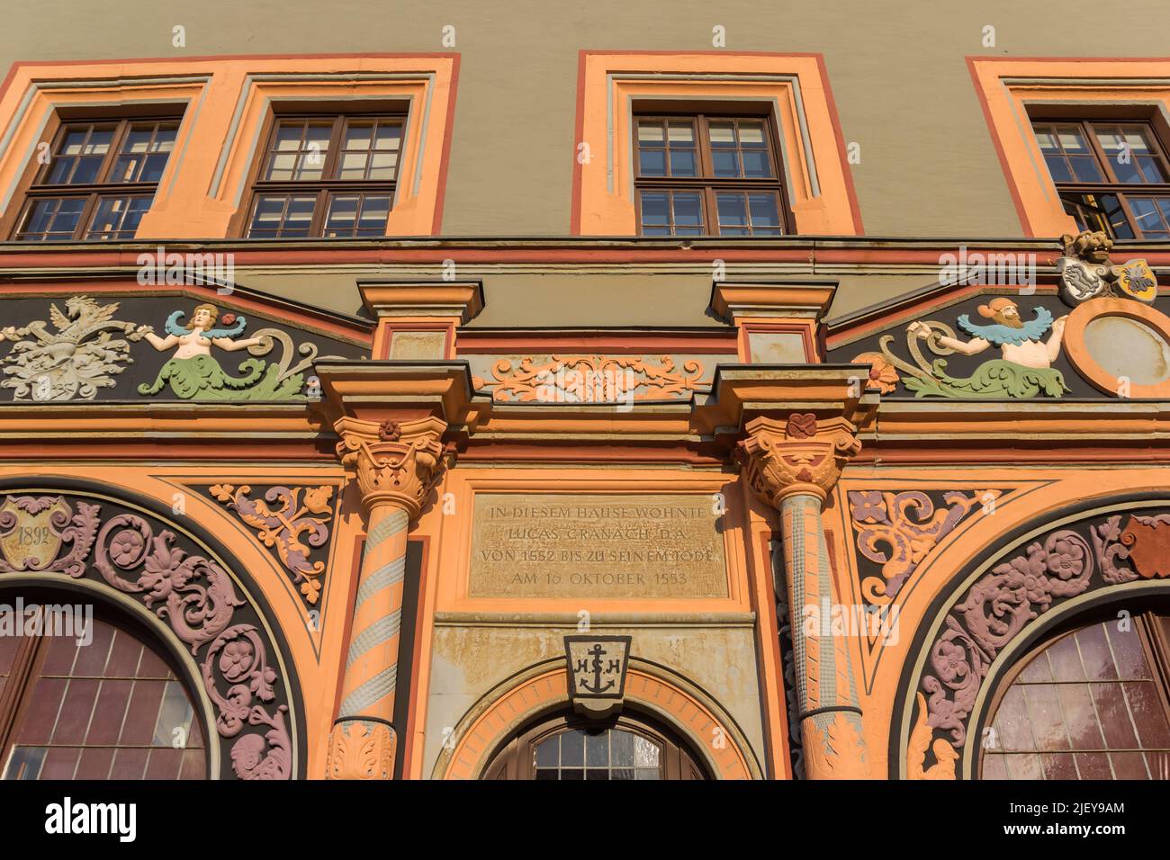 Colorful facade of a historic house on the central square of Weimar ...