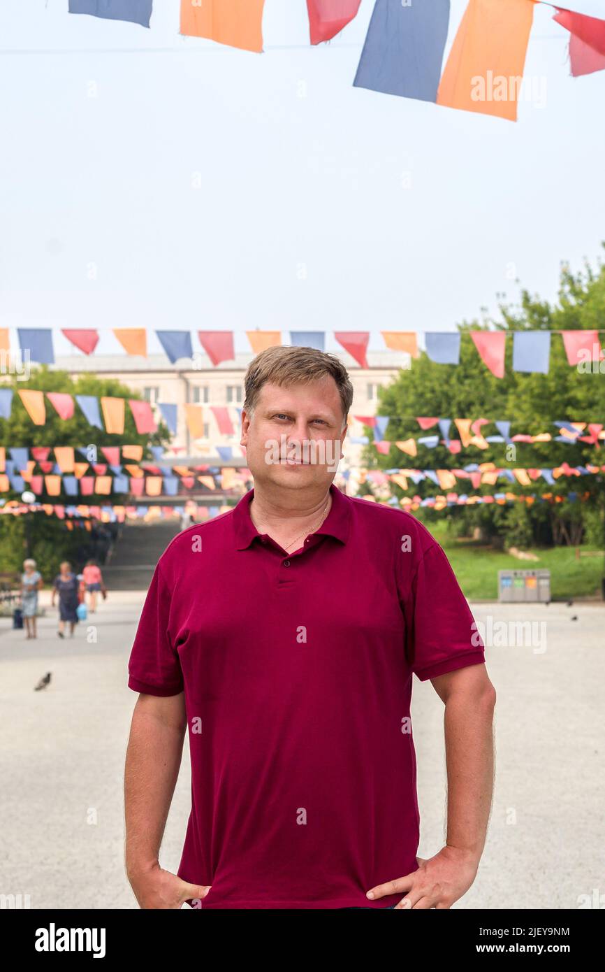Blond man city square on a national holiday Stock Photo - Alamy