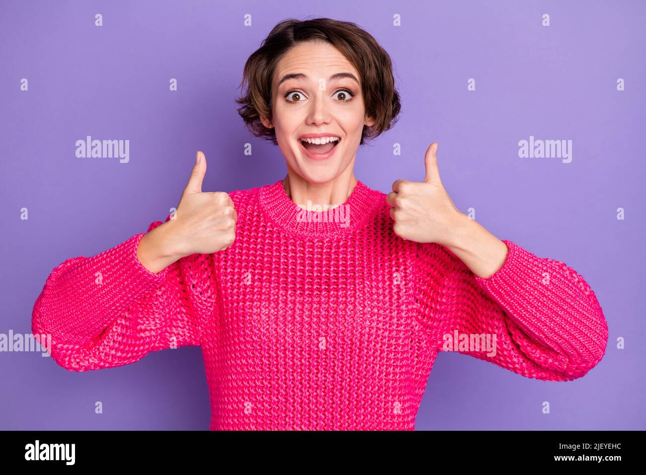 Portrait of impressed girl show approve sign wear pink sweater isolated ...