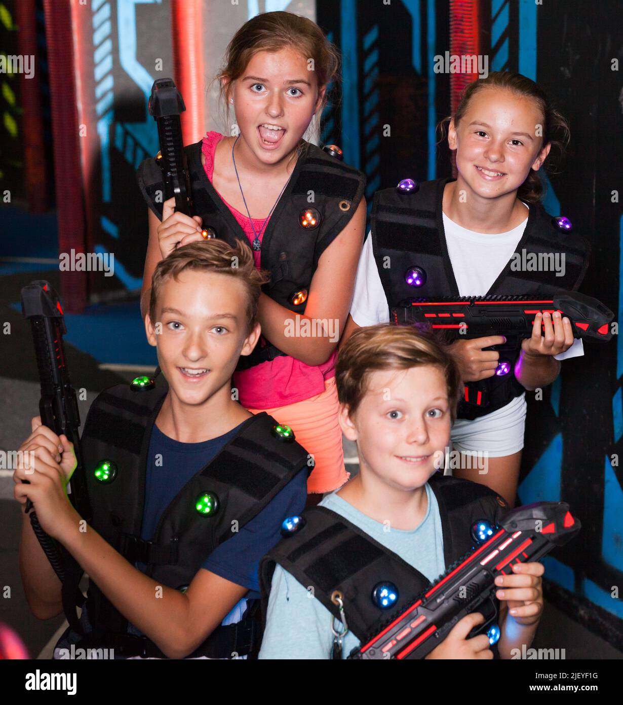 Happy teenagers with laser guns Stock Photo - Alamy
