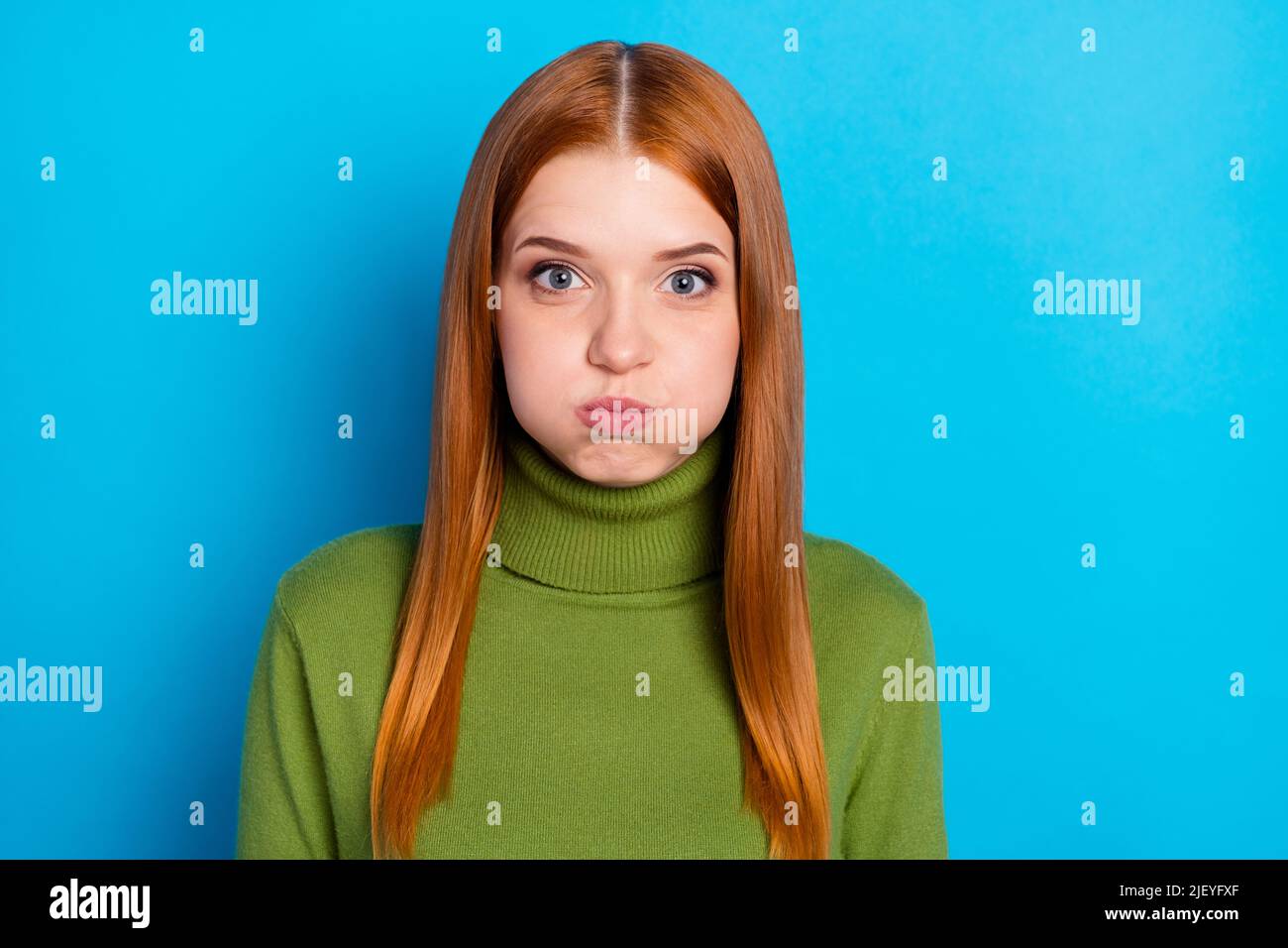 Photo of satisfied young person pouted cheeks holding breath look ...