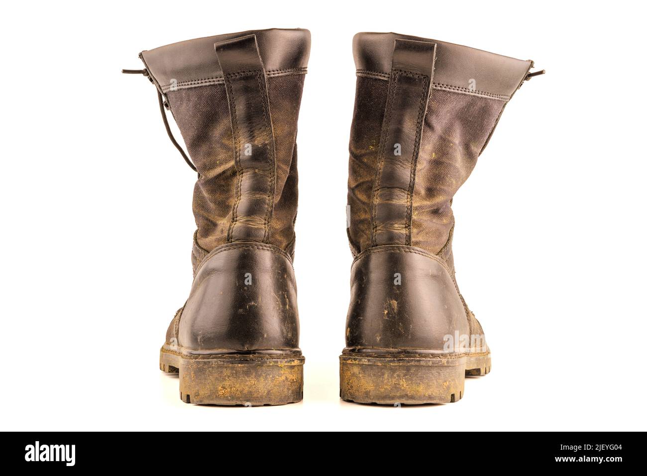 pair of dirty military style light ankle boots isolated on white ...