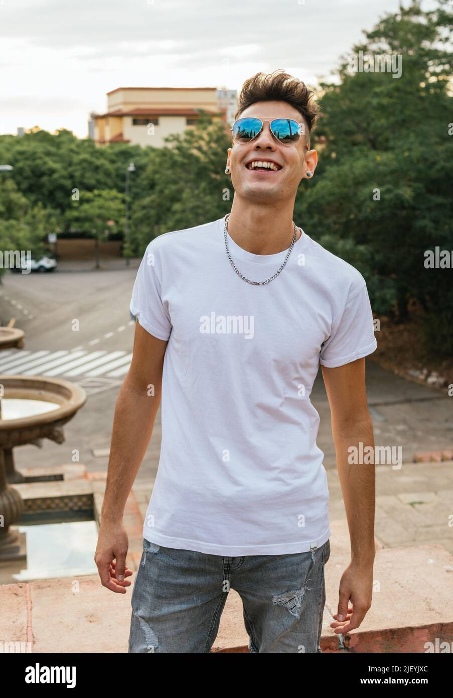 Happy man walking on square hi-res stock photography and images - Alamy