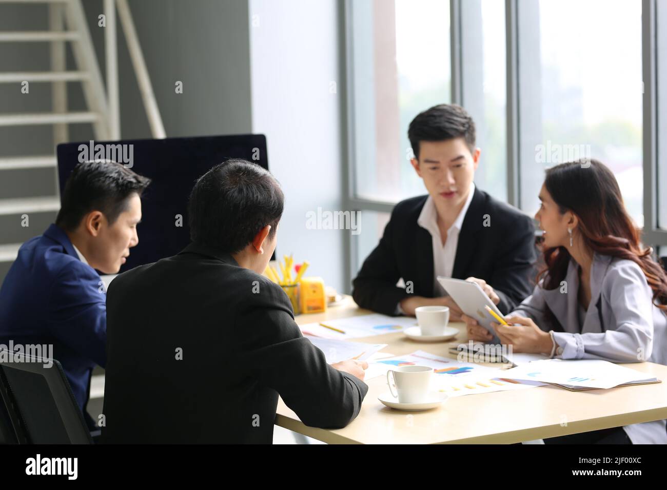 Businessman Giving Speech On Business Meeting With Colleagues ...