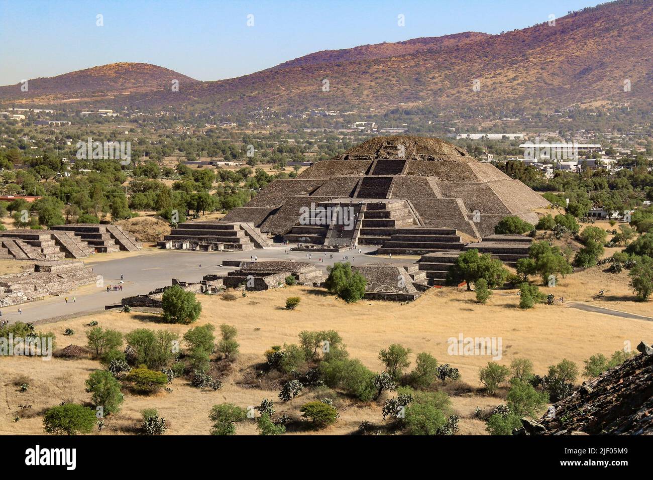 An aerial shot of the Pyramid of the Moon with mountains in the ...