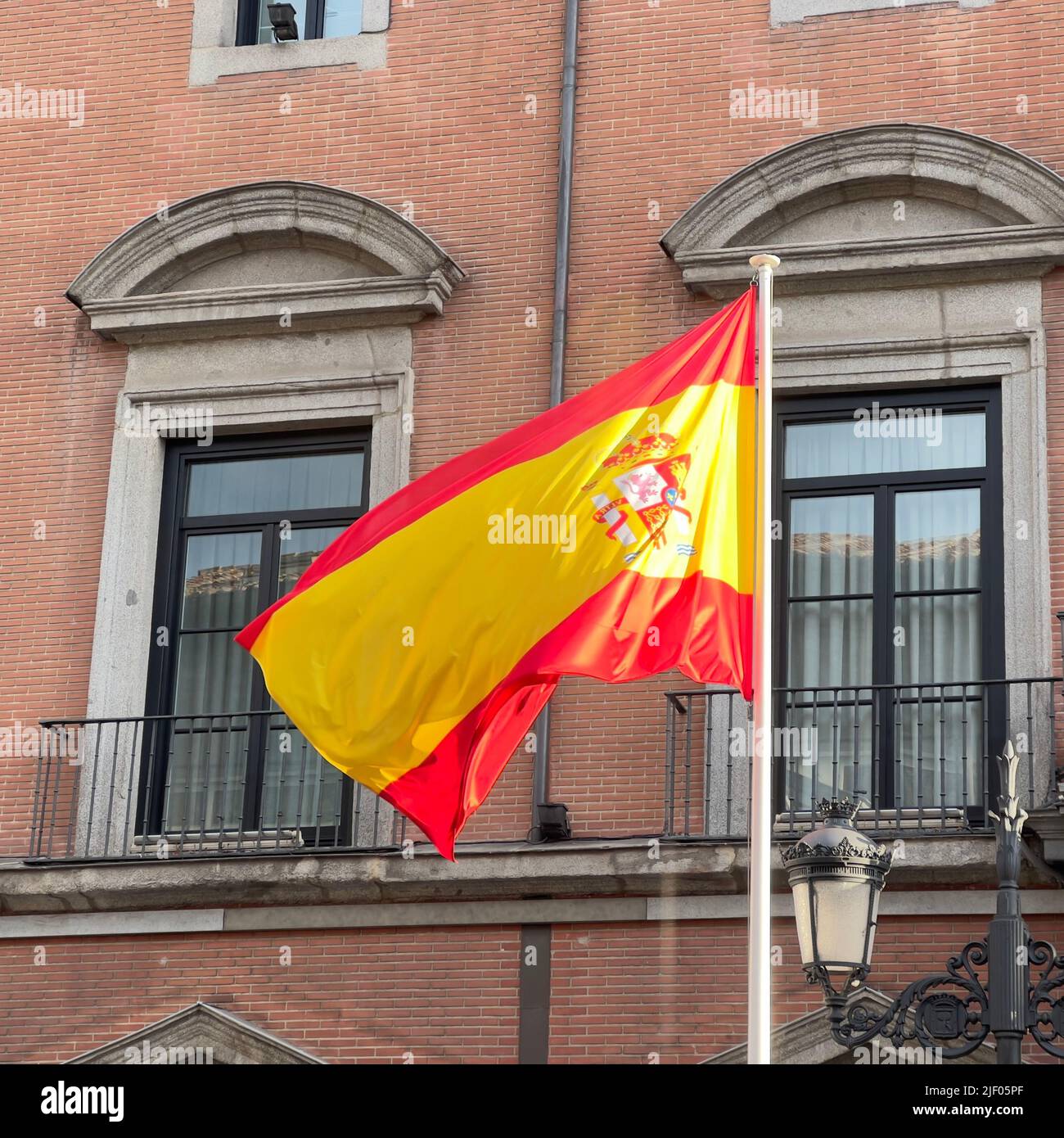 The Spanish flag on a building background Stock Photo - Alamy