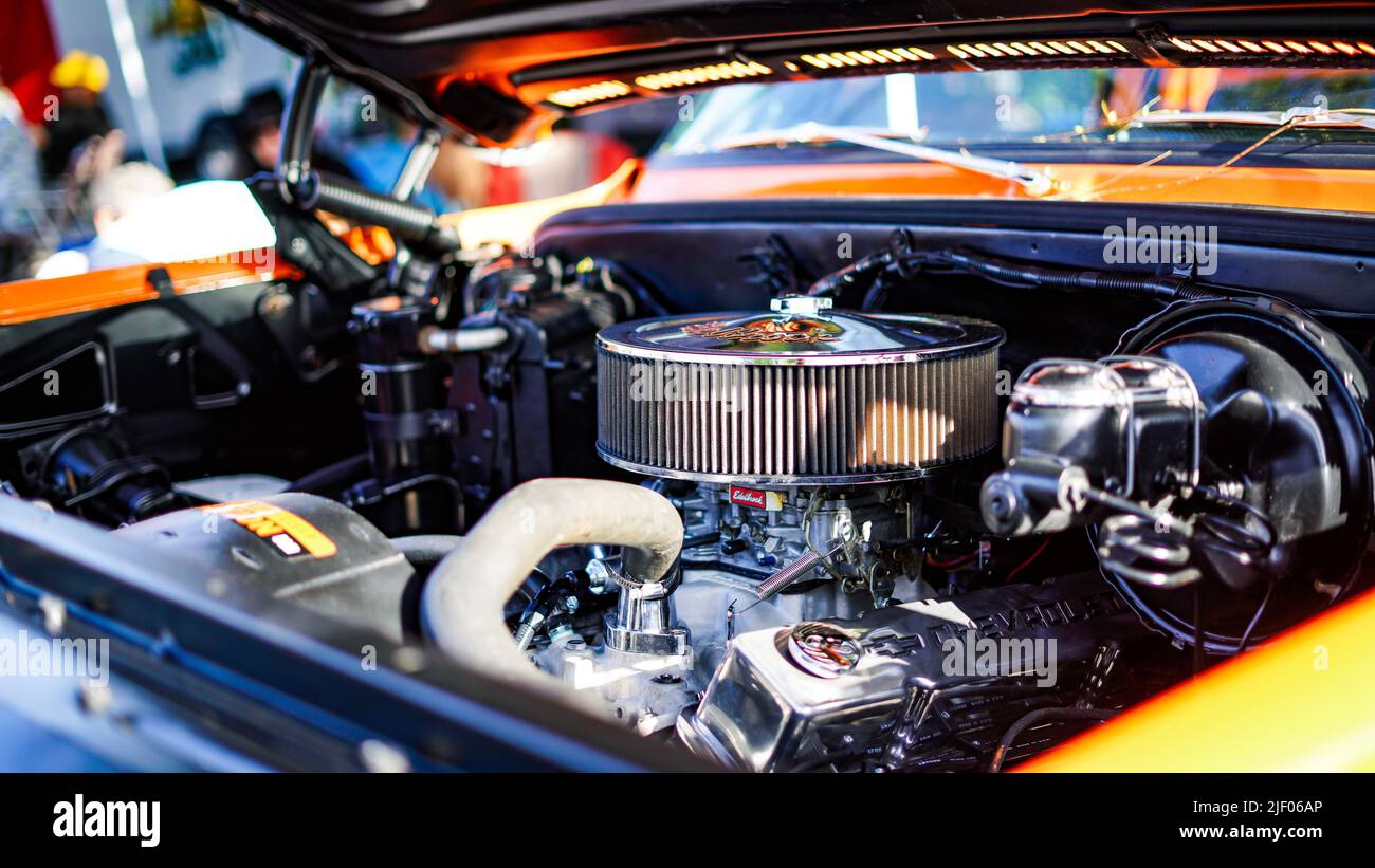 An orange pickup Chevrolet Cheyenne engine in a classic car show in ...