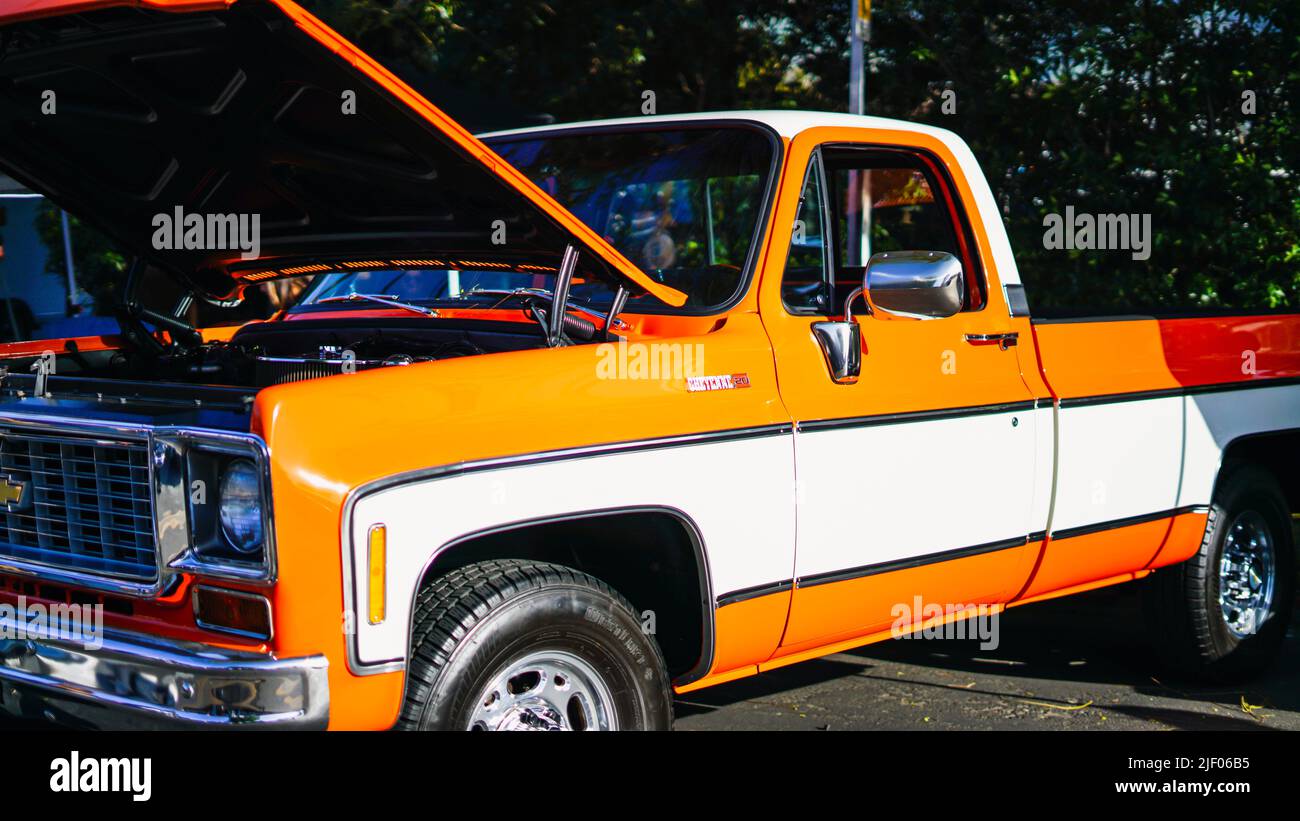 An orange pickup Chevrolet Cheyenne in a classic car show in Santa ...