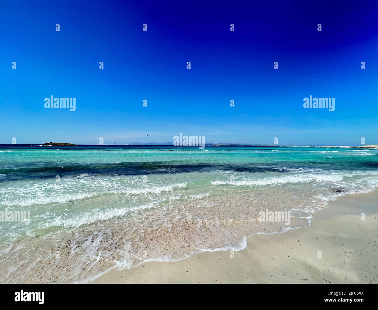 A soft blue ocean wave on the beach Stock Photo - Alamy