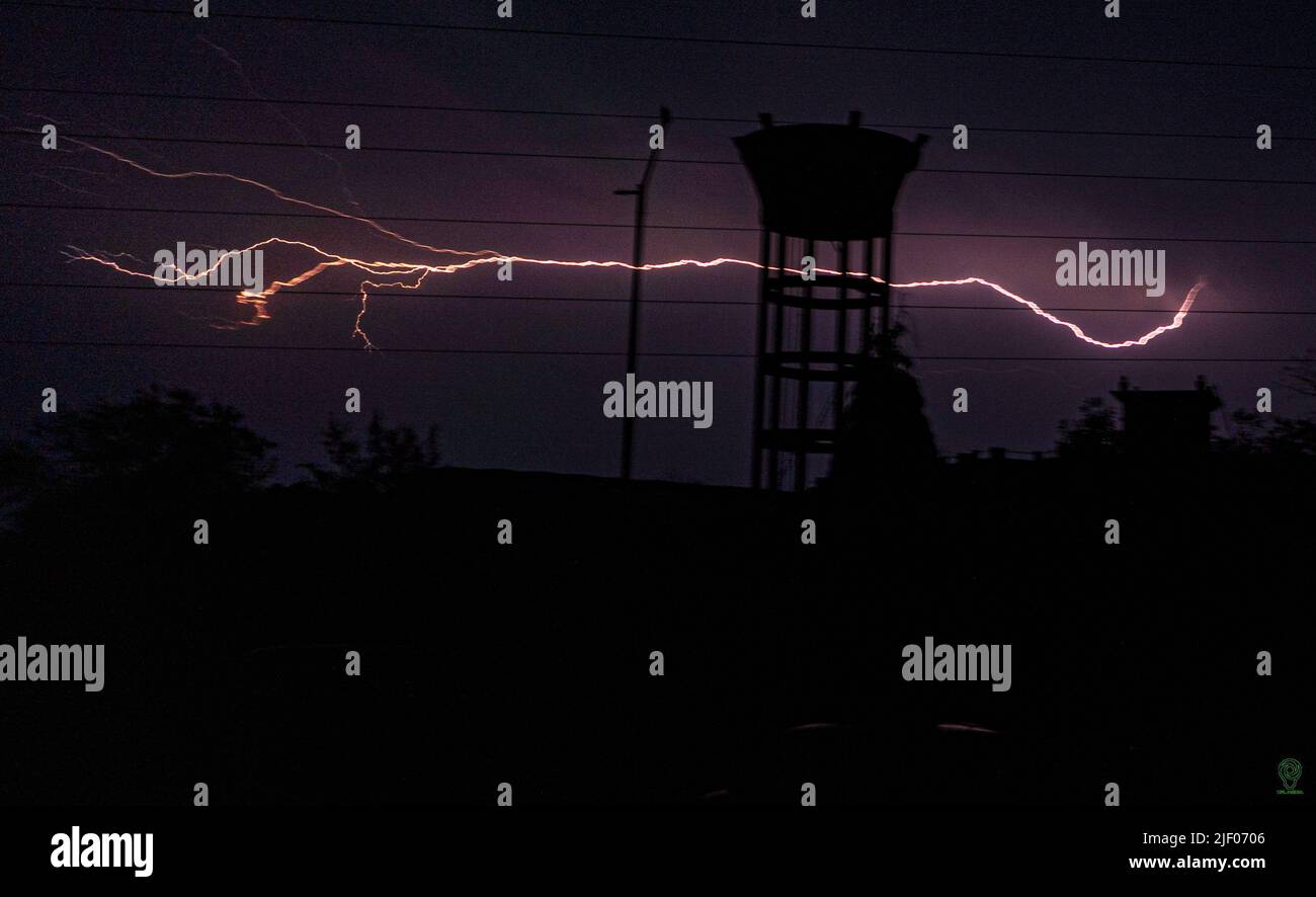 A lightning strikes at night Stock Photo - Alamy