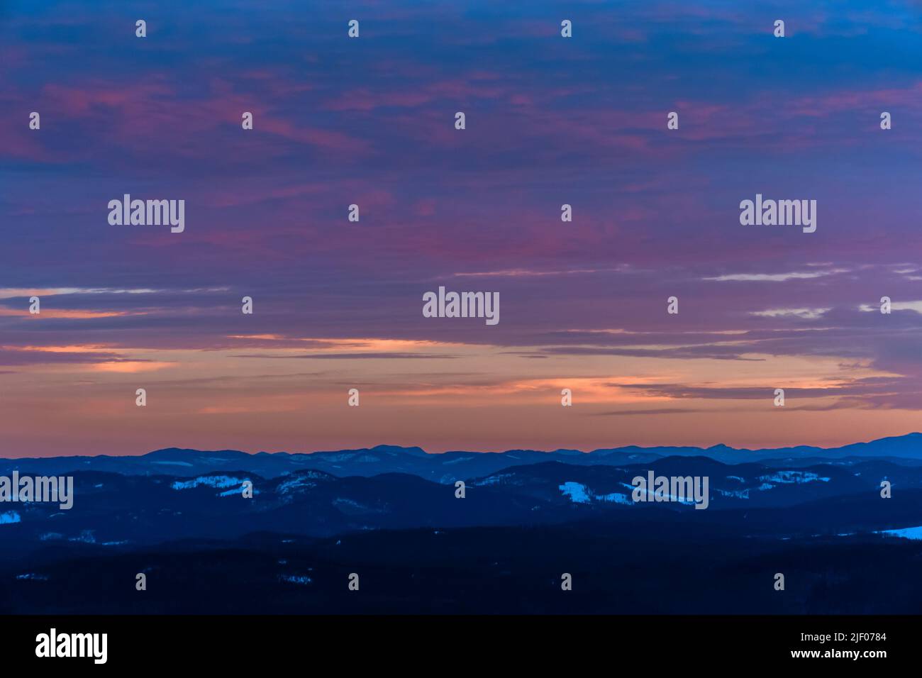 A view of Grandy Provincial Park mountain ranges with a colorful sunset ...