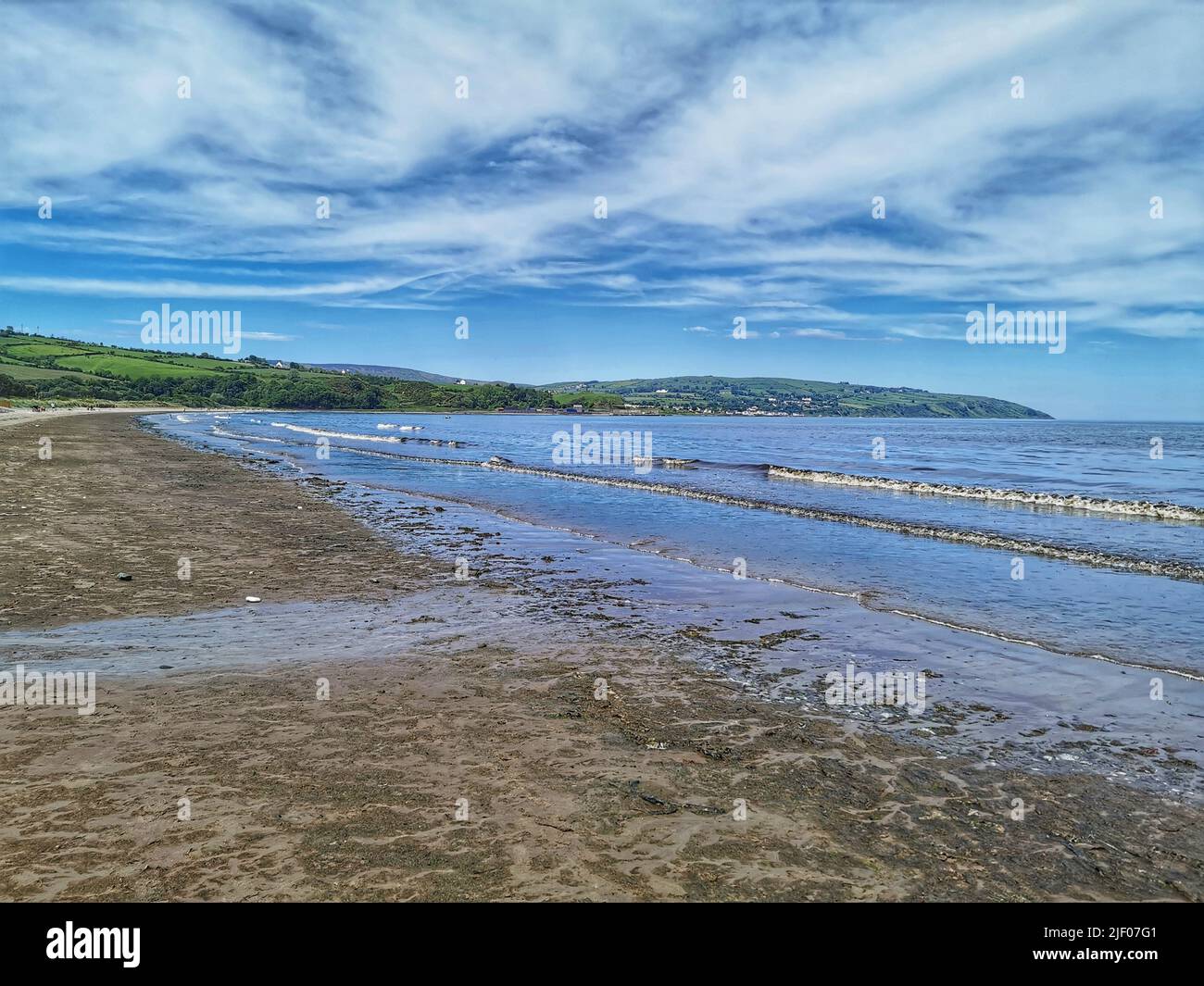 A beautiful view of the glens of Antrim from Waterfoot beach, County ...