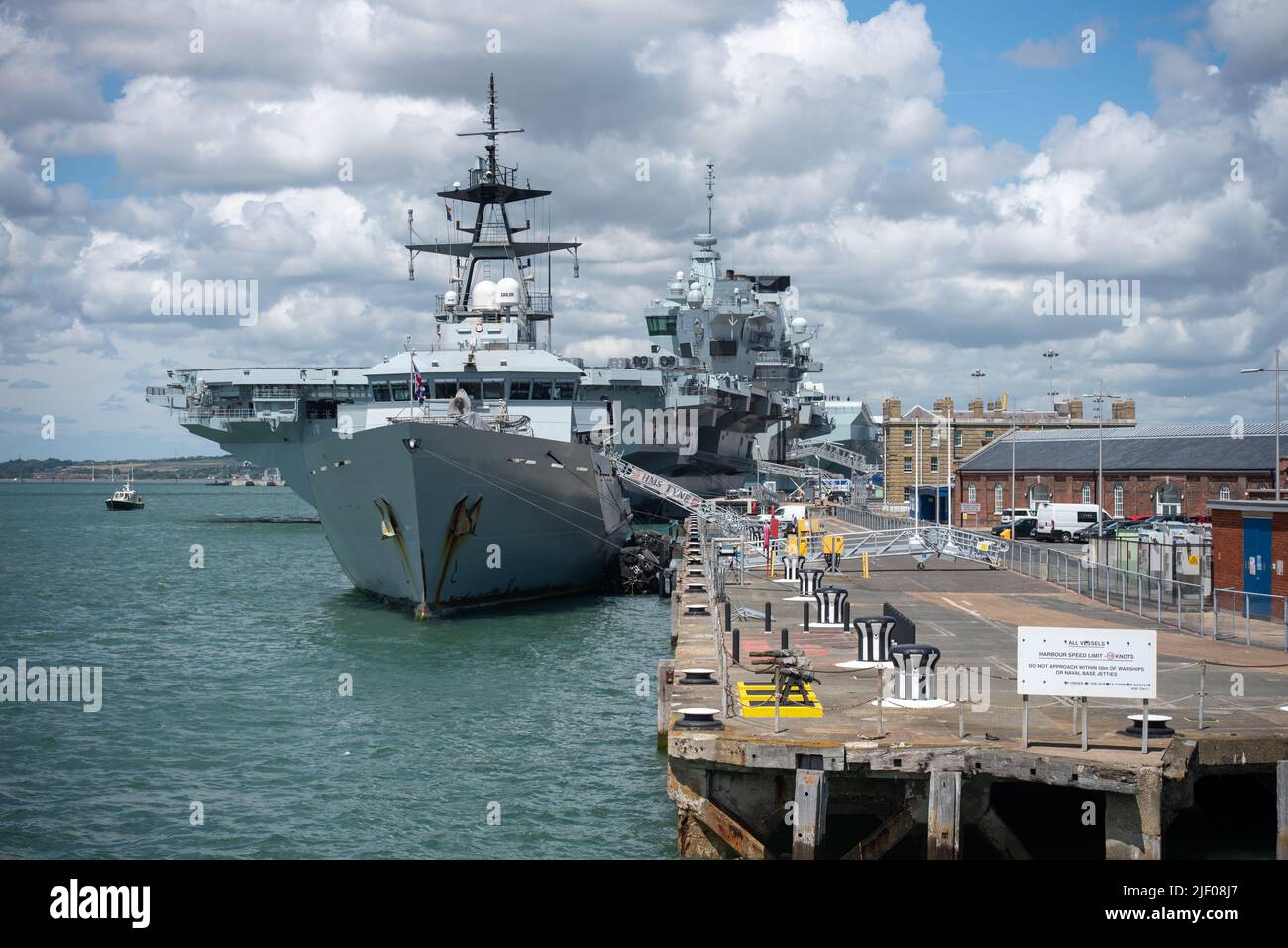 HMS Tyne P281 docked at Portsmouth naval base with the aircraft carrier ...