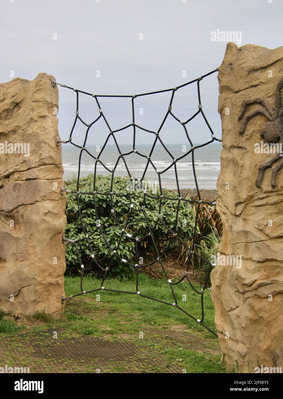 A vertical shot of spider web climbing frame in the garden Stock Photo ...