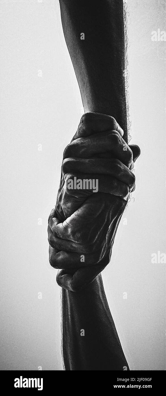 A grayscale shot of strong arms holding each other-bond, union ...