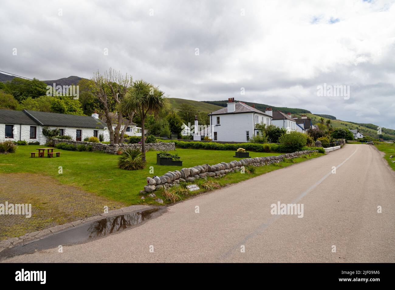 The A841 road passing through the village of Pirnmill, Isle of Arran ...