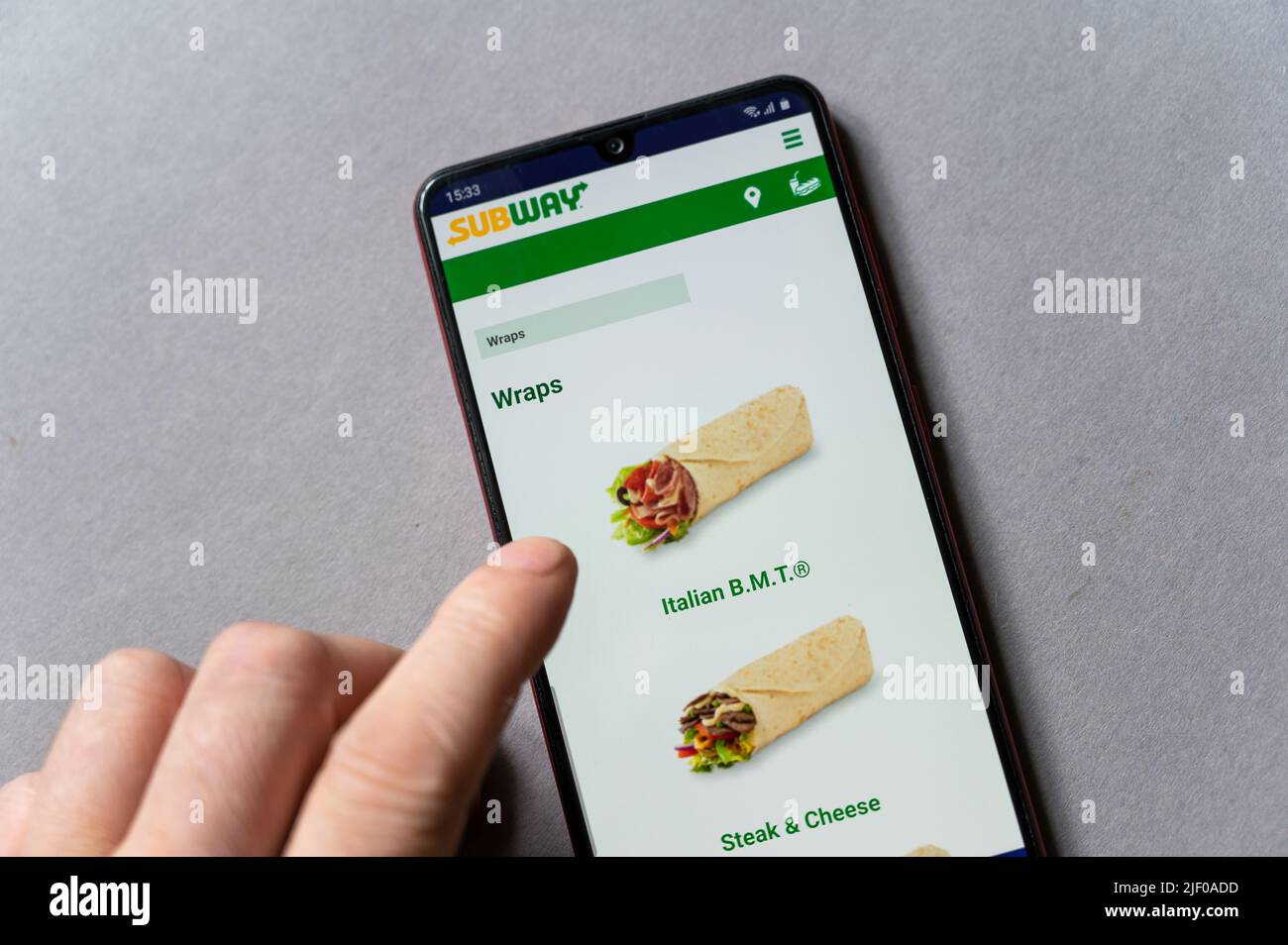 A man chooses wraps on the SUBWAY website. An American chain of fast ...