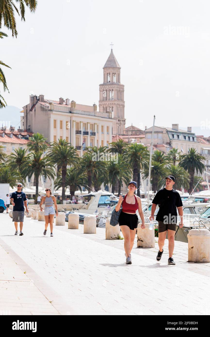 People walking along the Riva , Split's famous waterfront promenade ...