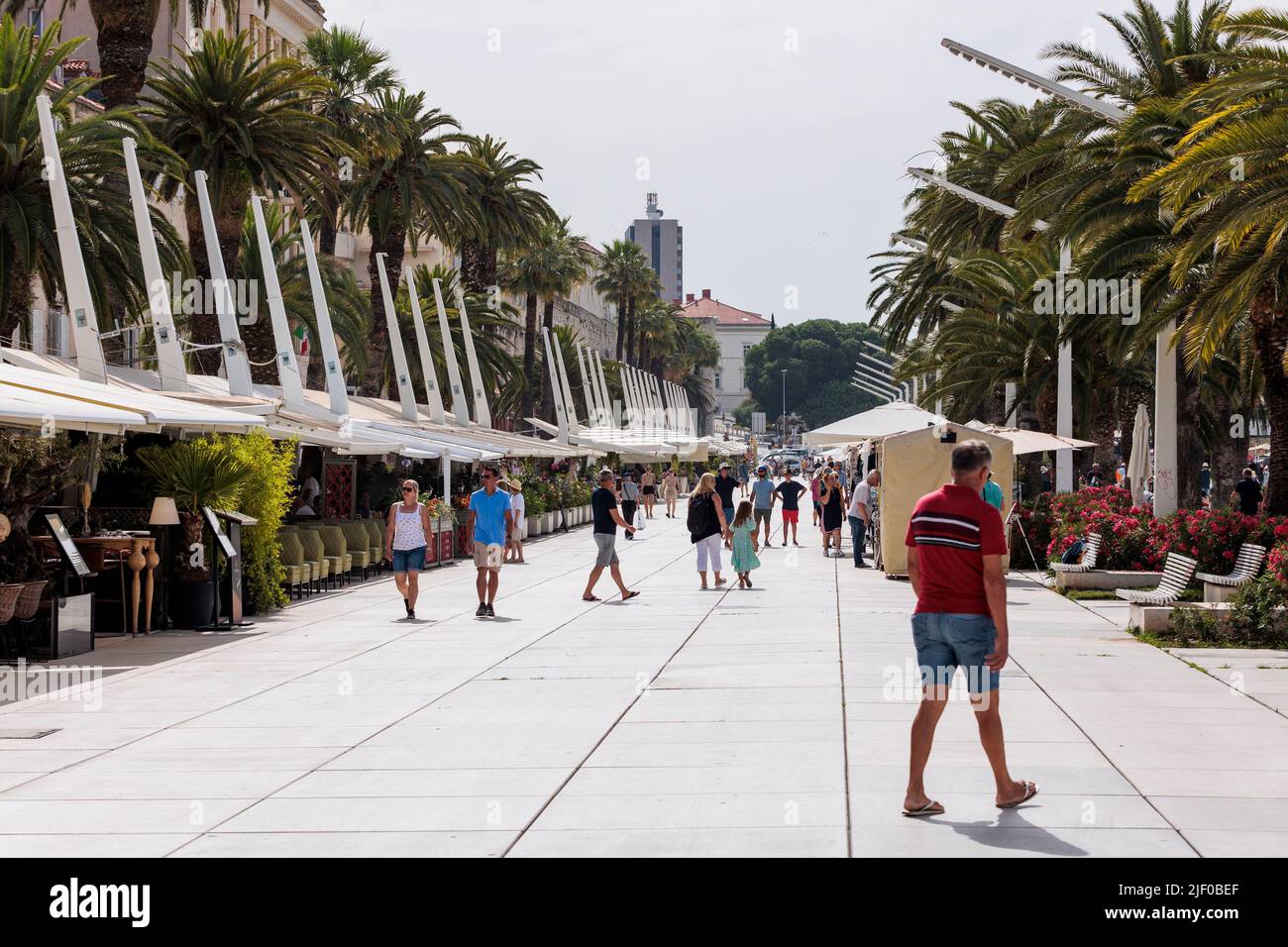 People walking along the Riva , Split's famous waterfront promenade ...