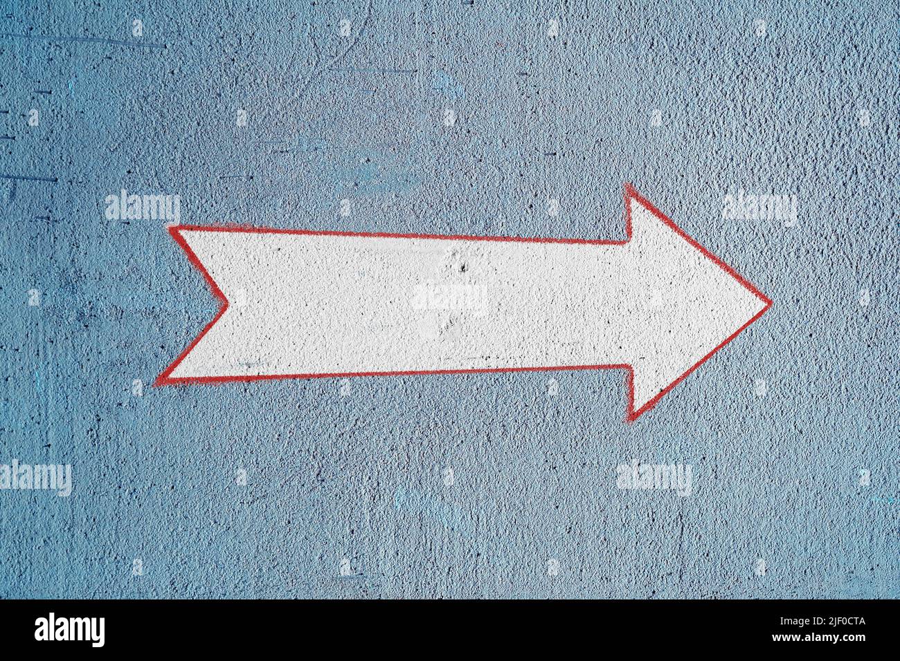 Arrow on white wall hi-res stock photography and images - Alamy