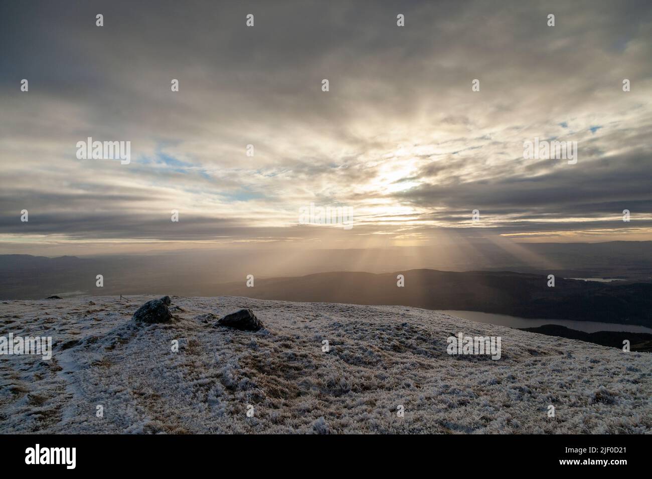 Heaven rays from the summit of Ben Ledi mountain with Loch Venachar ...