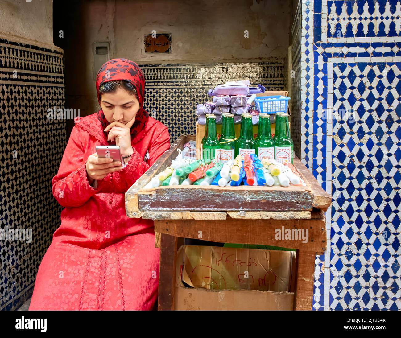 Morocco Fez. A woman with her smartphone in the Medina Stock Photo - Alamy