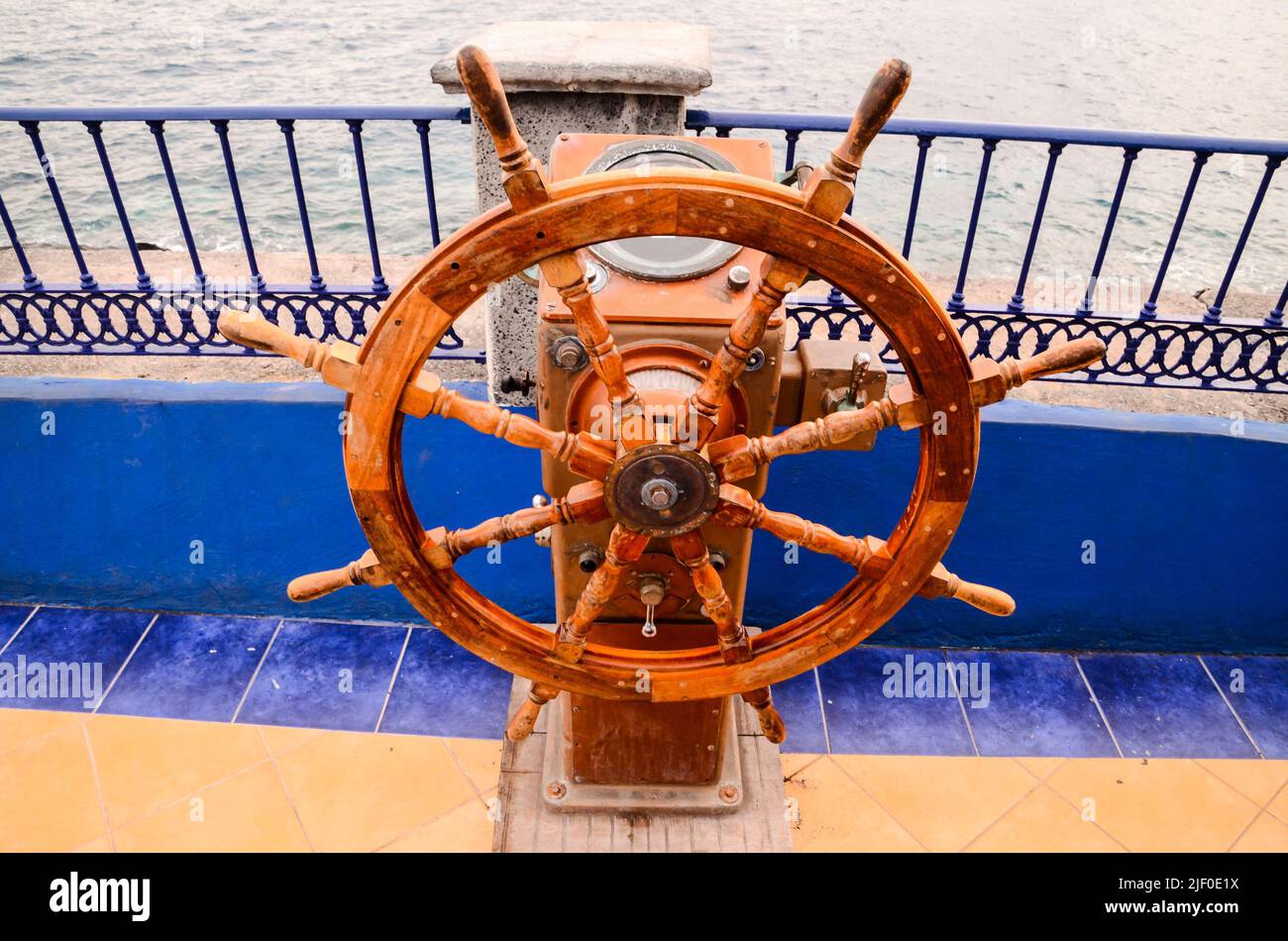 Old Vintage Wooden Helm Wheel near Blue Ovcean Stock Photo - Alamy