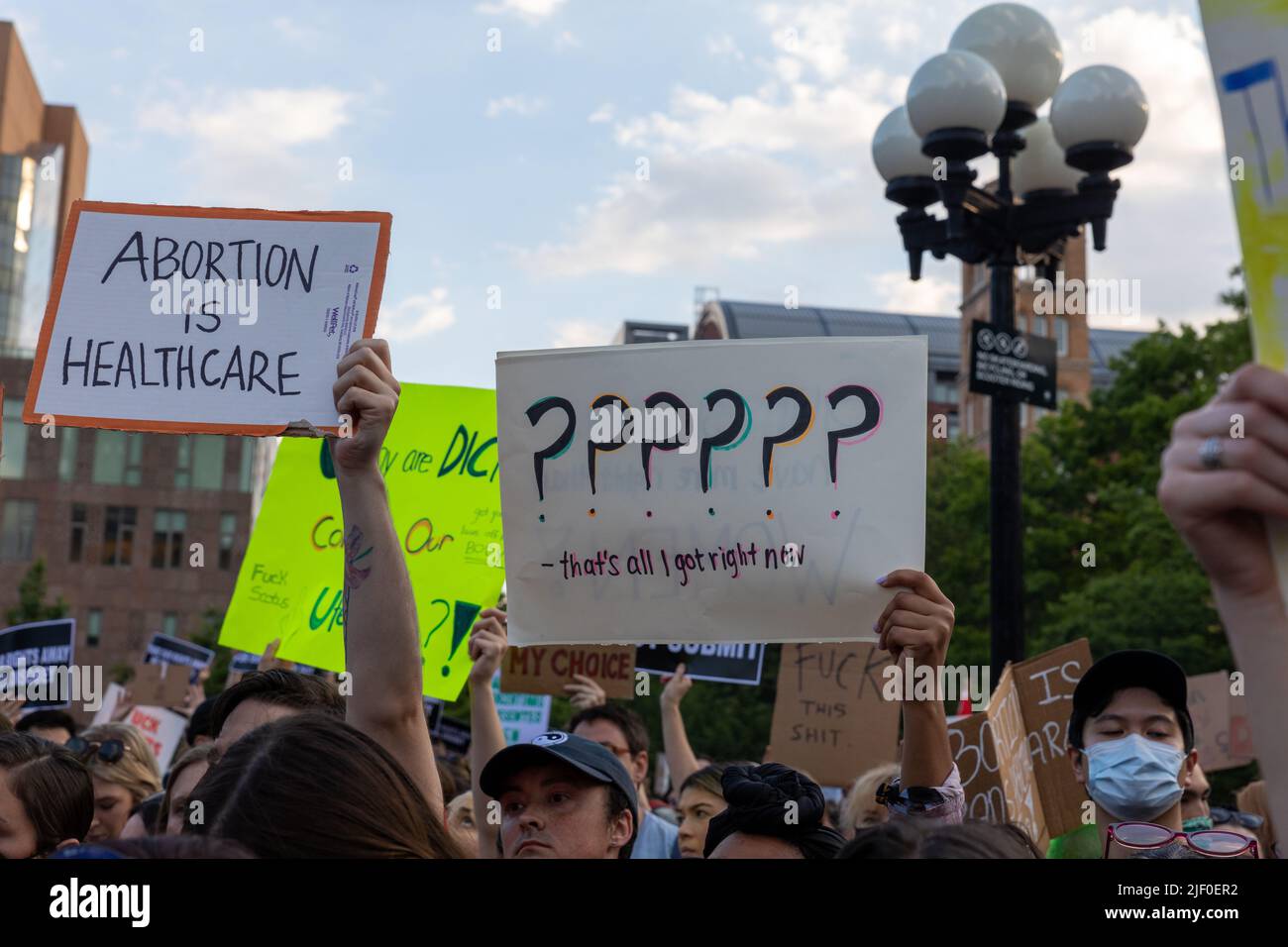 A crowd of protesters holding demonstration signs after the Supreme ...