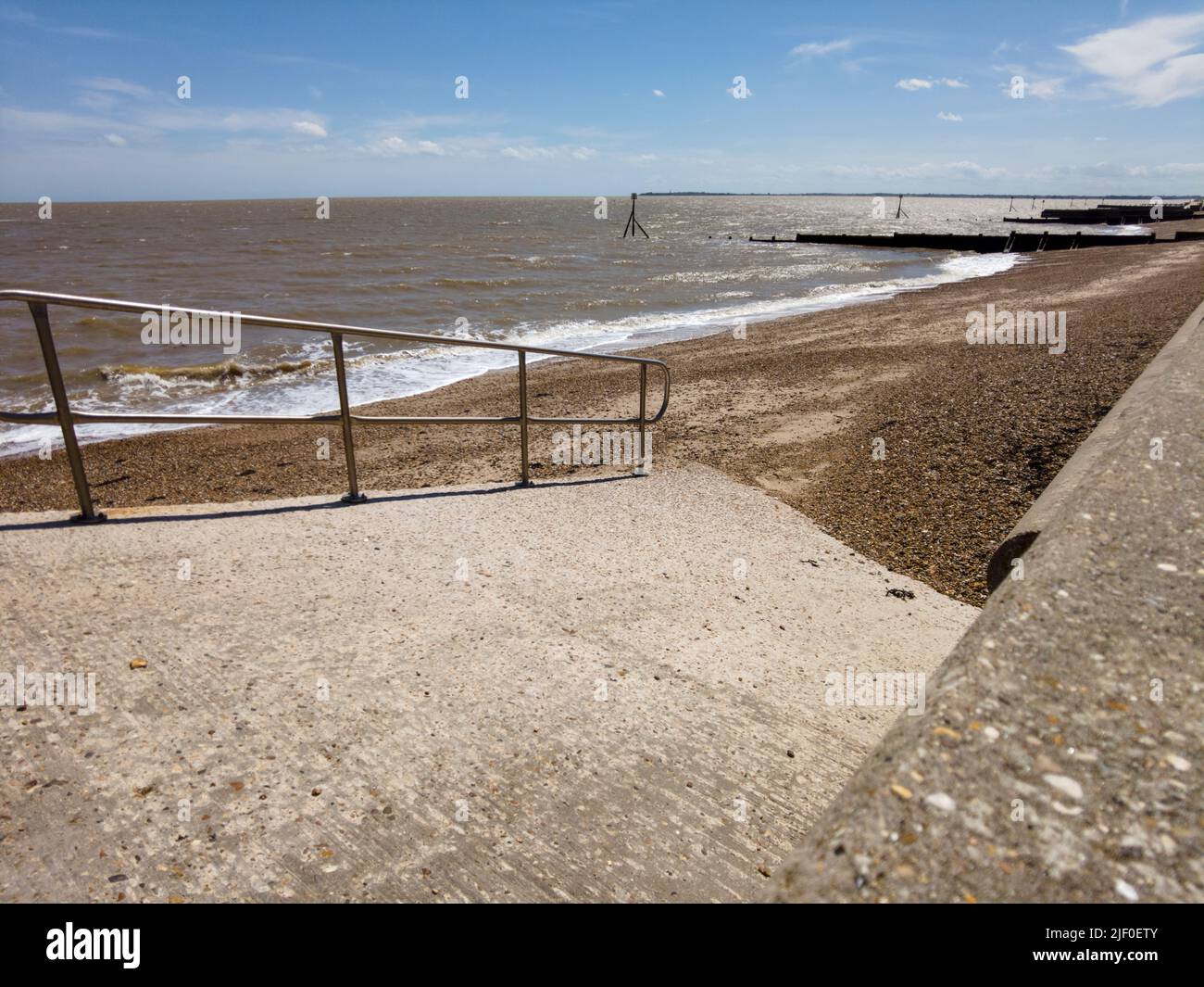 The concrete boat ramp to pebble beach. Dovercourt, Harwich, Essex ...
