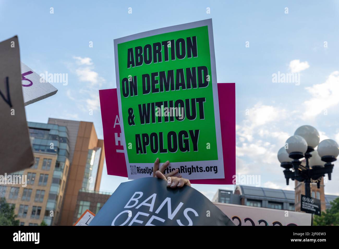 A crowd of protesters holding demonstration signs after the Supreme ...