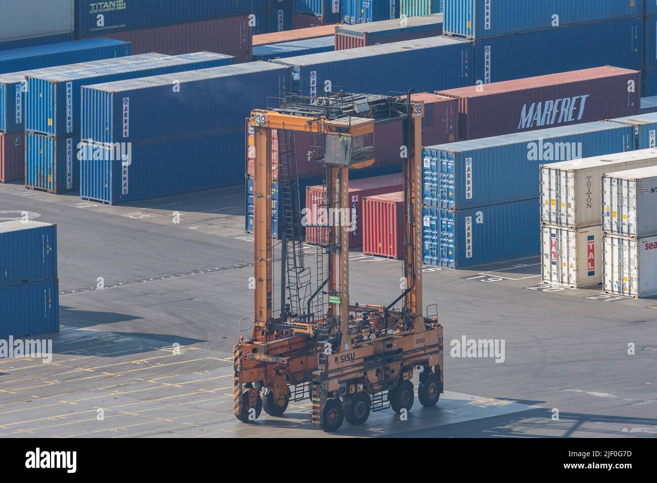 Heavy duty cranes on the port lifting containers. Sisu Stock Photo - Alamy
