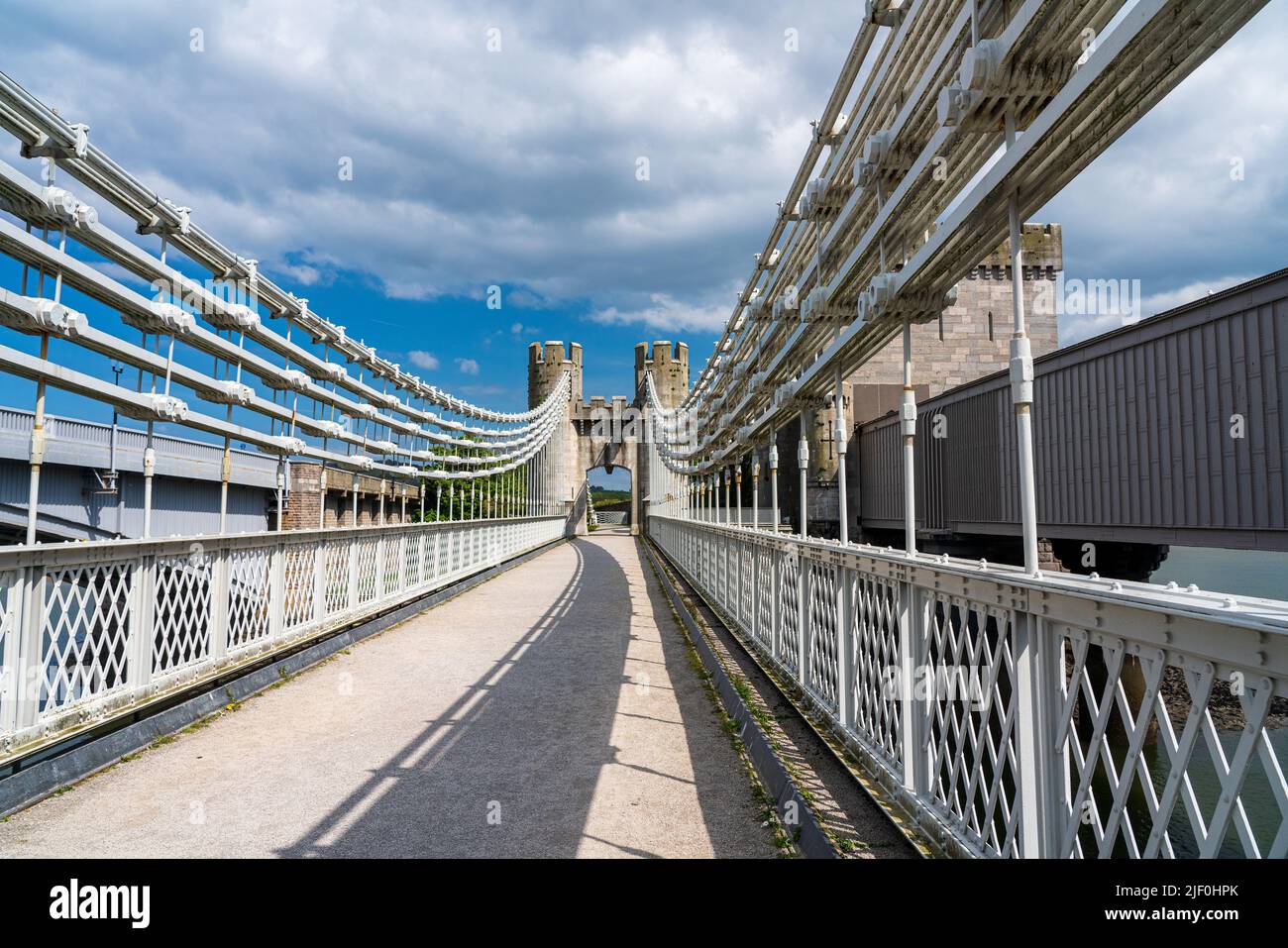 Historic Thomas Telford suspension bridge leading to the ancient castle ...