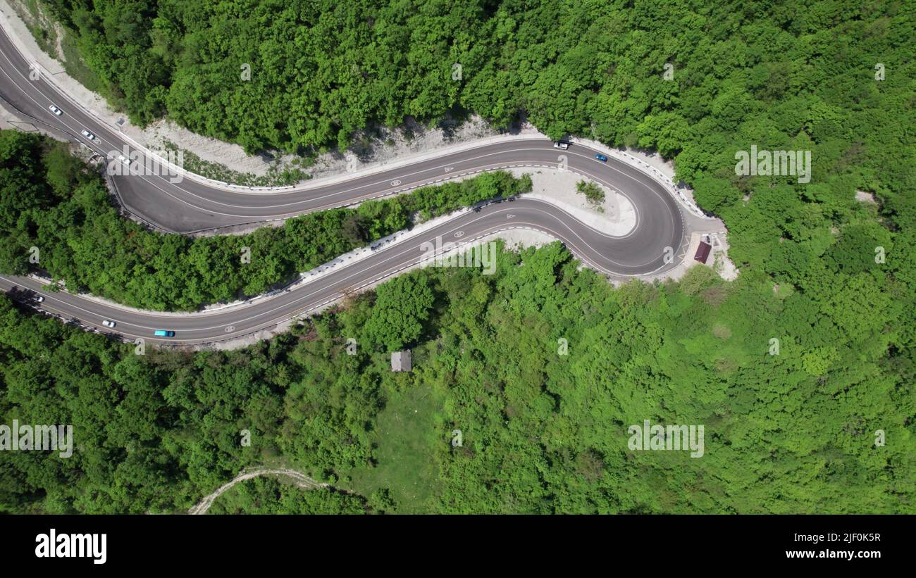 Aerial view of winding road from the high mountain pass. Great road ...