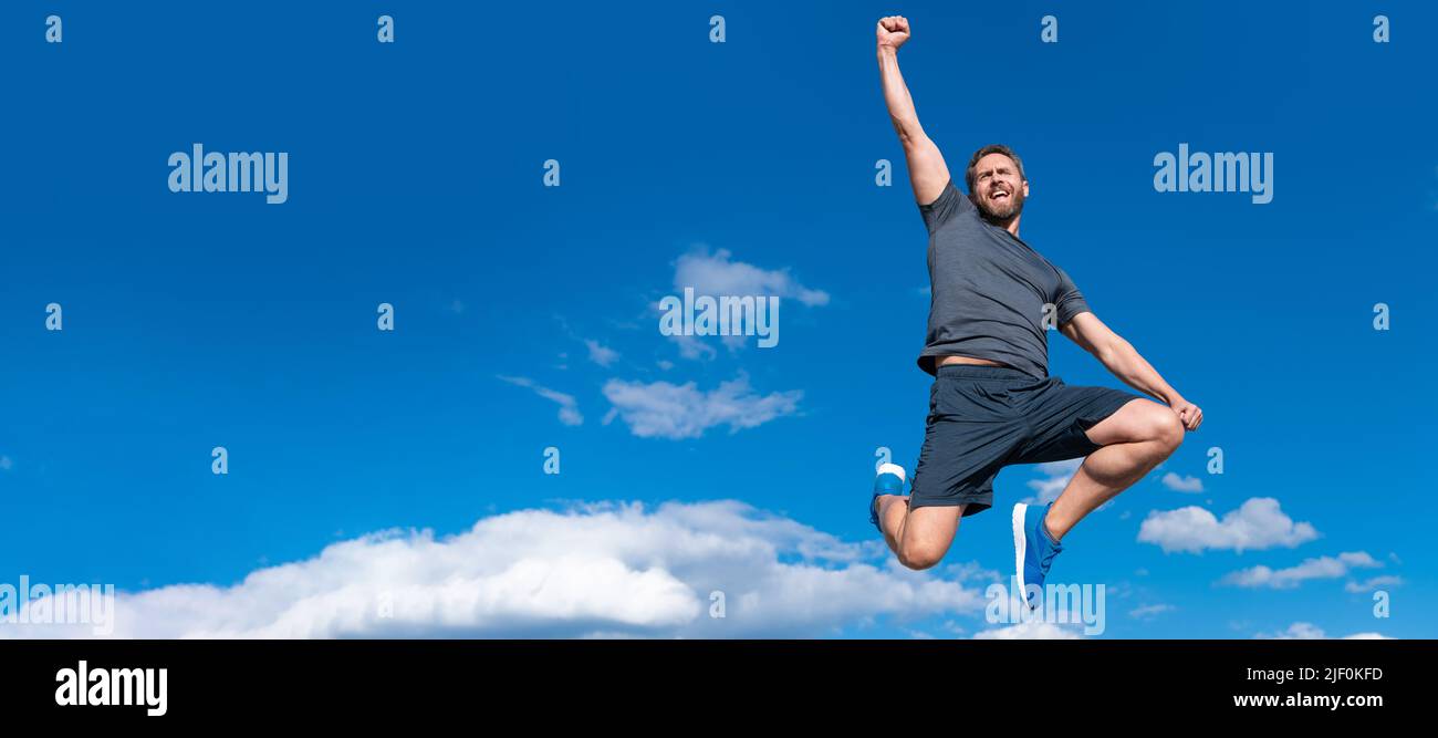 Man running and jumping, banner with copy space. muscular man jumping ...