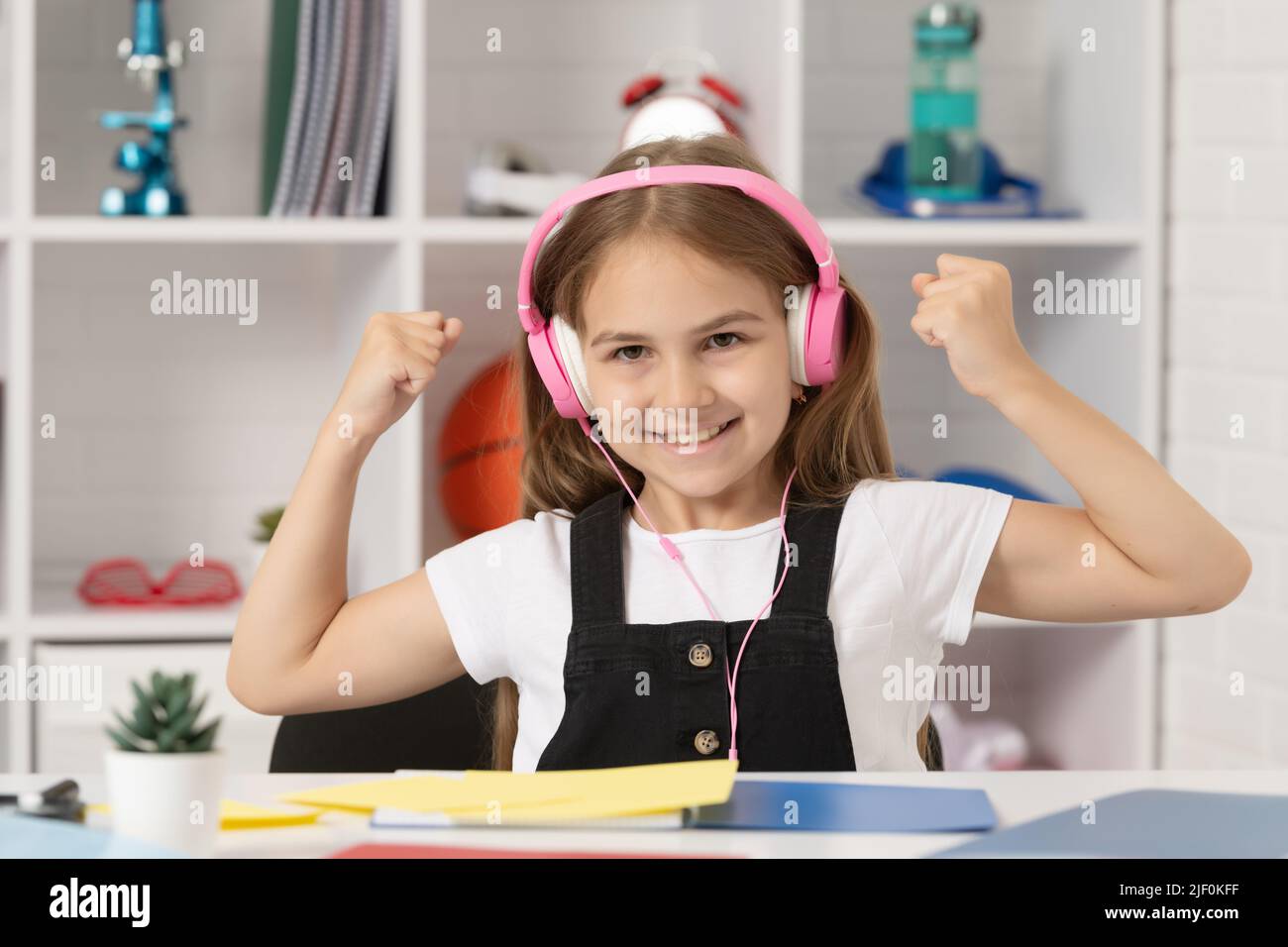 successful kid listen to music in headphones at school classroom Stock ...
