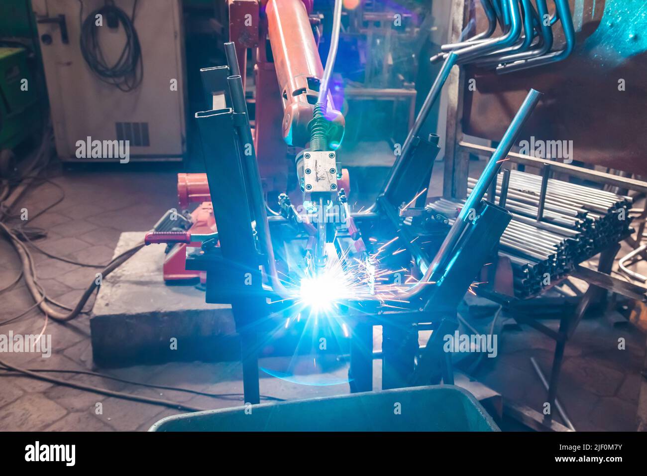 Robot is engaged in welding in factory Stock Photo - Alamy