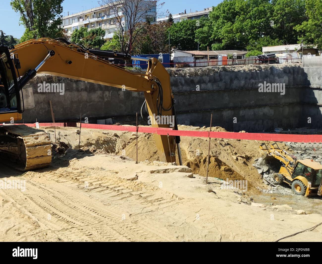 Excavators digging foundation construction site hi-res stock ...