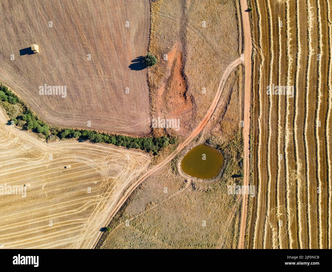 Aerial view of farm fields, dirt roads and water basin Stock Photo - Alamy