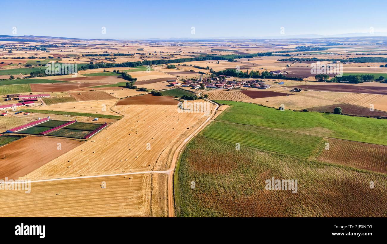 Aerial view of agricultural fields and rural town in the background ...
