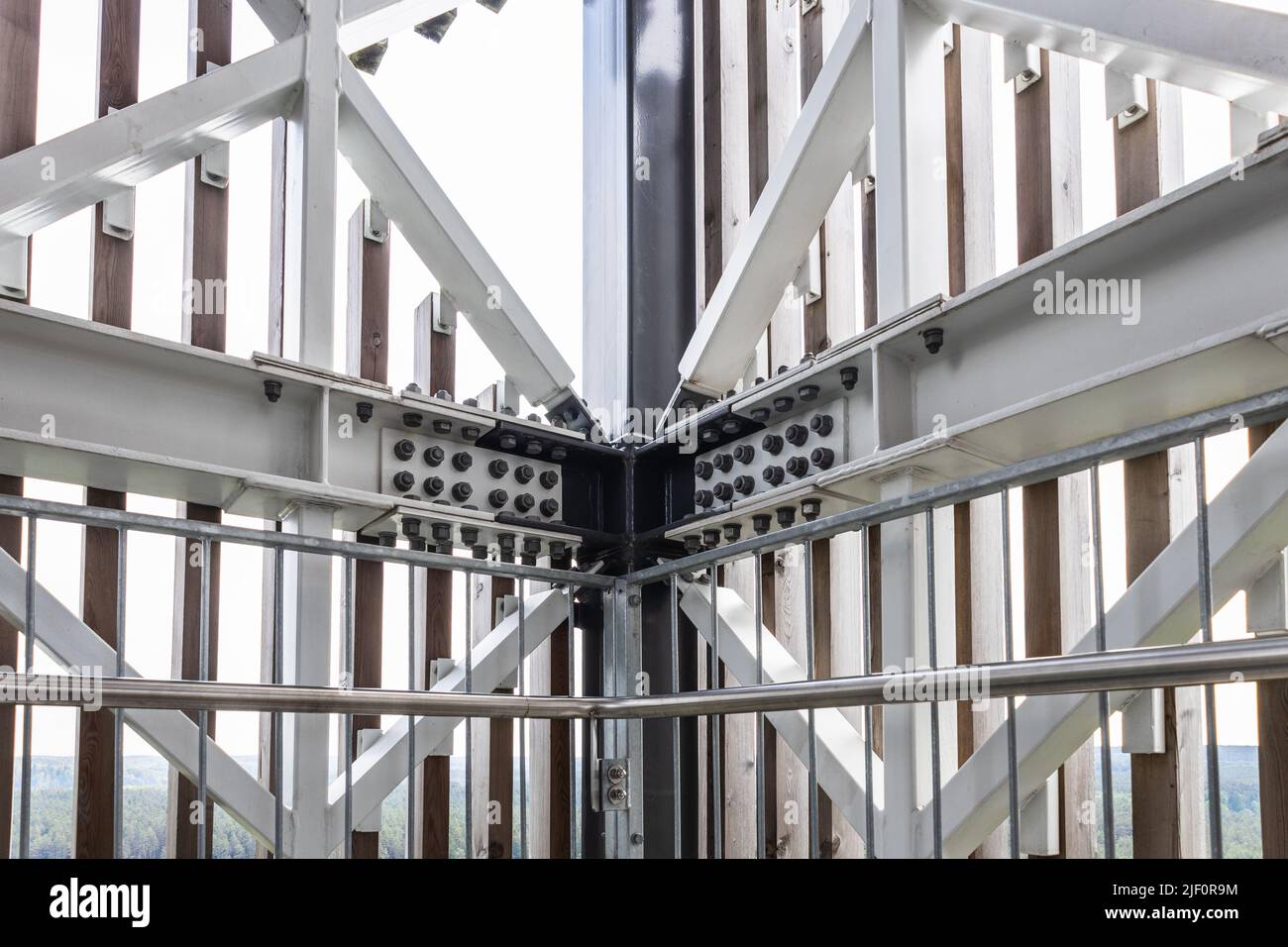 Massive industrial steel construction end-to-end with bolts and nuts on ...