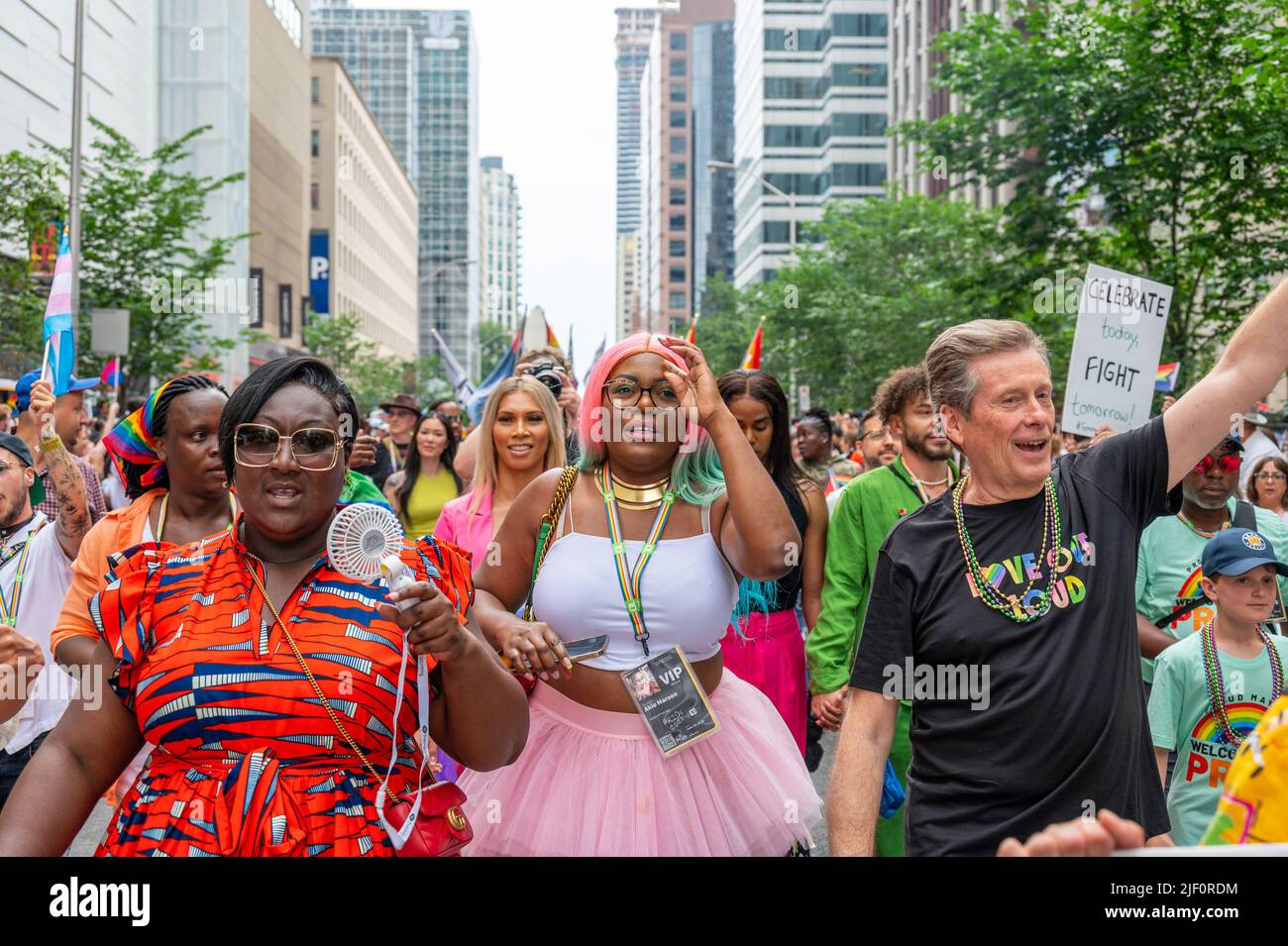 Lady Phyll, Akio Maroon, and John Tory (left to right) marching on ...