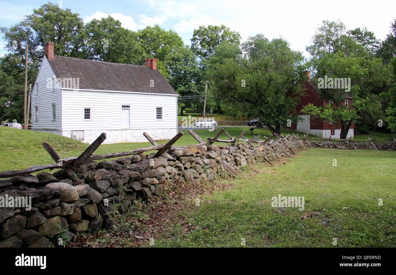 Boehm House, ca. 1750, and old stone fence, at Historic Richmond Town ...